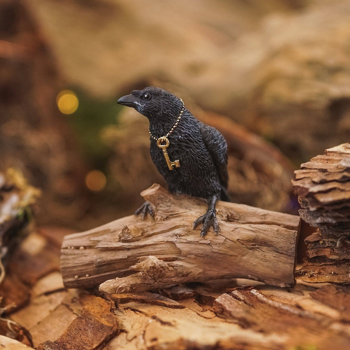 Raven with Key on Tree Log
